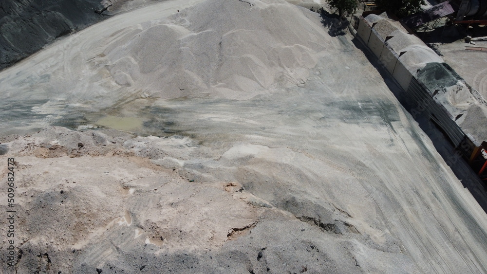 An aerial view of the piles of fine stone in the quarry. Fine stone is ...