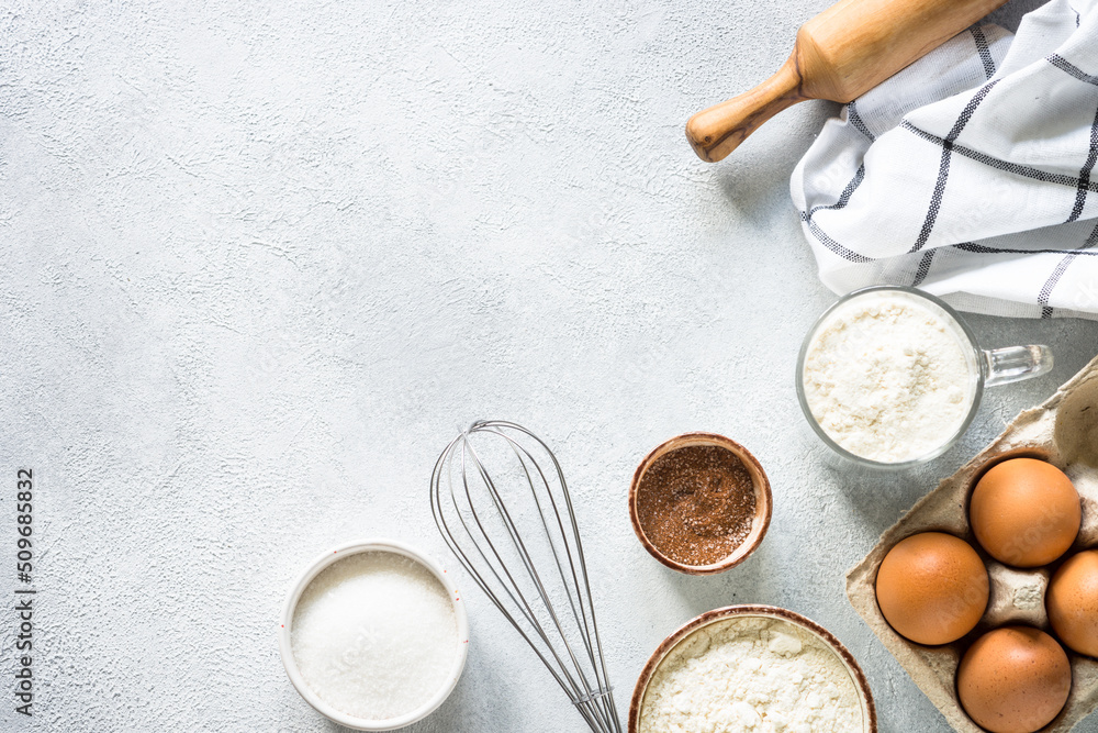 Baking background at light stone table. Flour, sugar, eggs and rolling ...