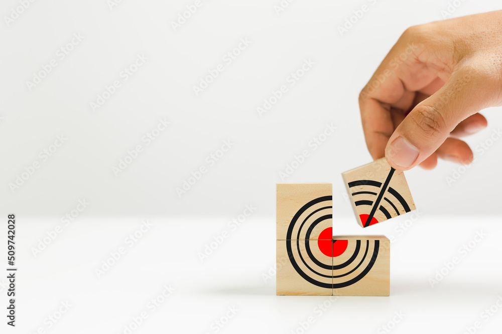 Connection partner to goal concep. Hand holding wooden cube block ...