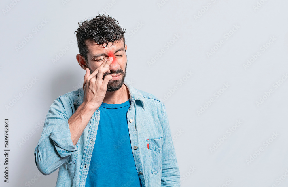 Person with pain touching nose. A person with nasal bridge pain, Man ...