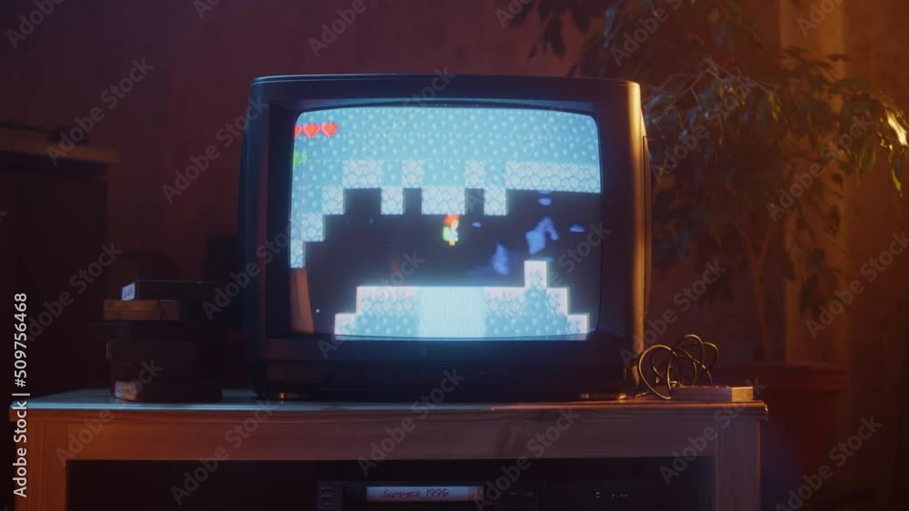 Video „Close Up Footage of a Retro TV Set Screen with an Eight Bit ...
