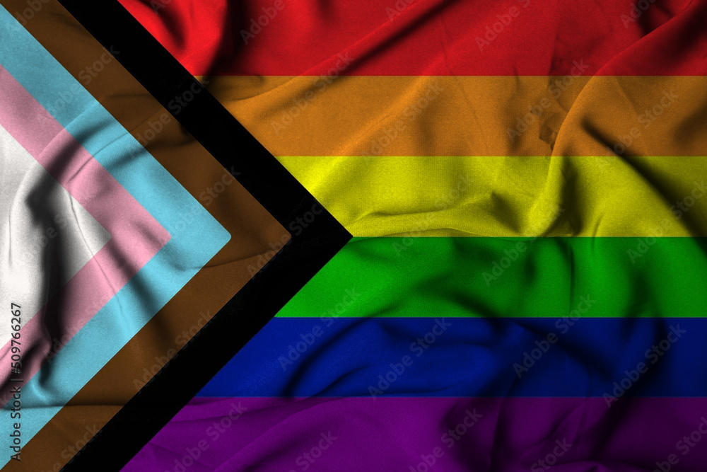 selective focus on the wavy satin LGBTQ progress flag, one of the ...