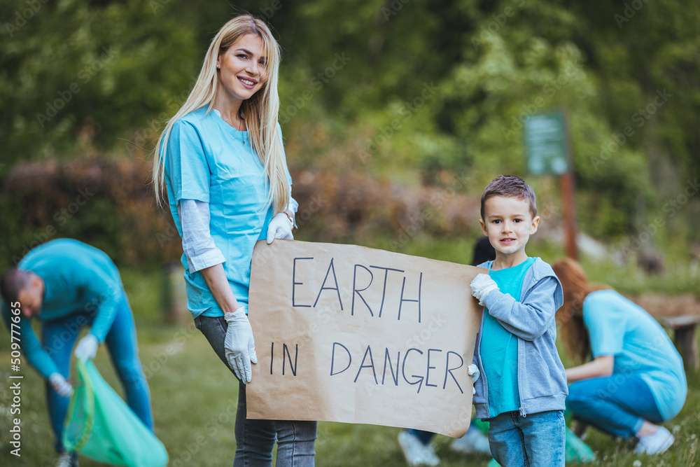 Teaching kids how to preserve nature is very important! Volunteers hold ...