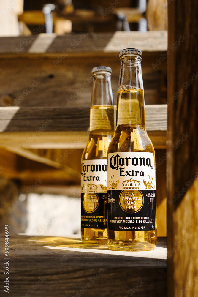 Corona Extra beer glass bottles on wooden stairs of a countryside house on sunny weekend. Stock ...