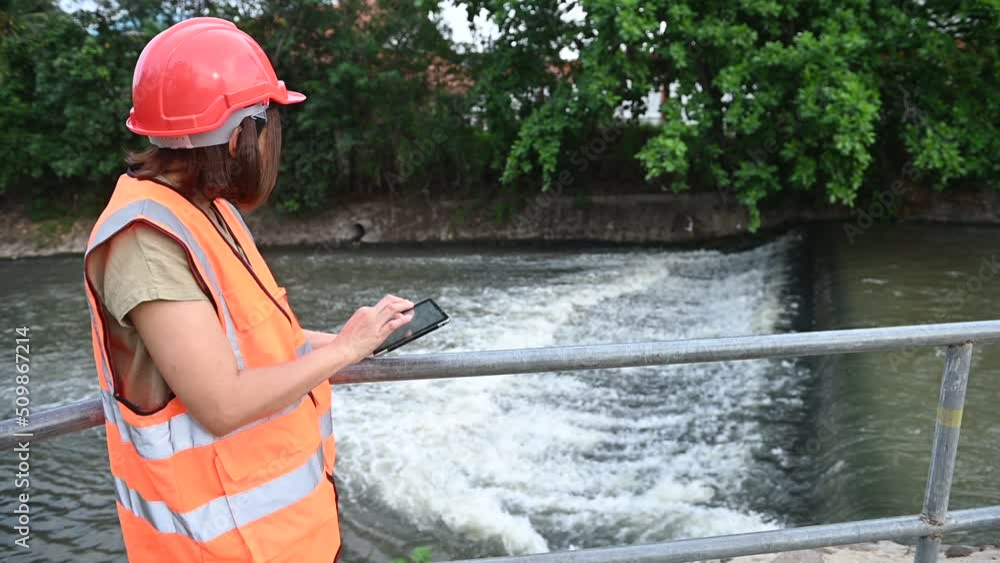 Asian Female engineering working at sewage treatment plant,Marine ...