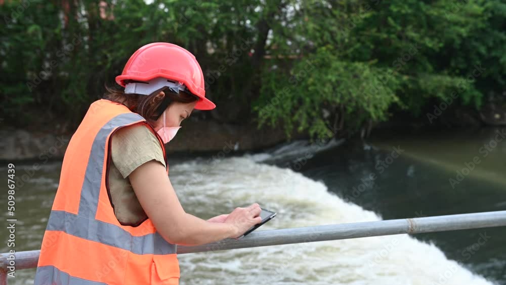 Asian Female engineering working at sewage treatment plant,Marine ...