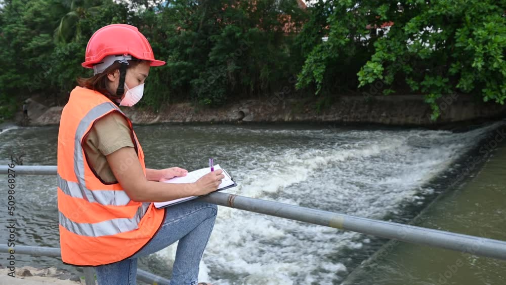 Asian Female engineering working at sewage treatment plant,Marine ...