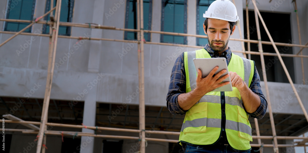 Professional worker holding tablet are working on the construction site ...