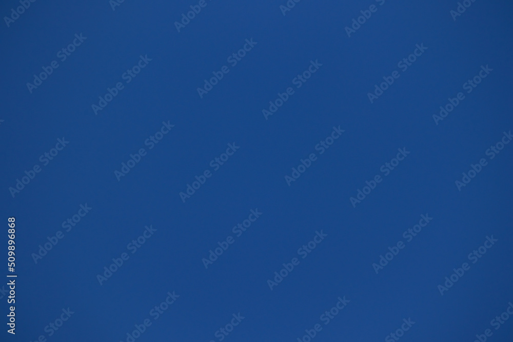 Background, section of a cloudless sky of royal blue color. Stock Photo ...