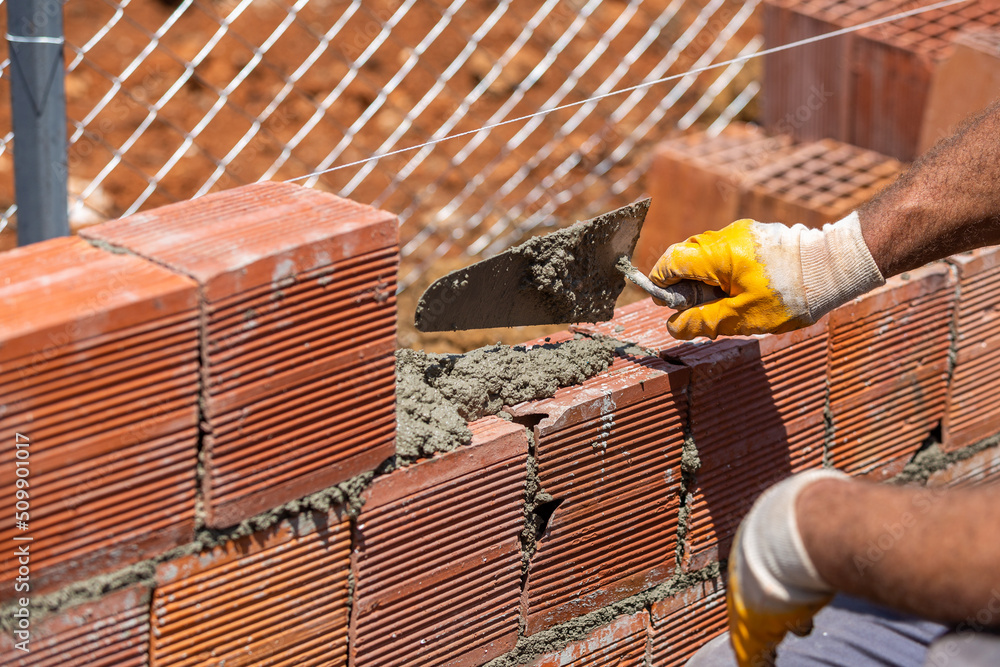 Masters who make concrete mortar and masonry in construction Stock ...