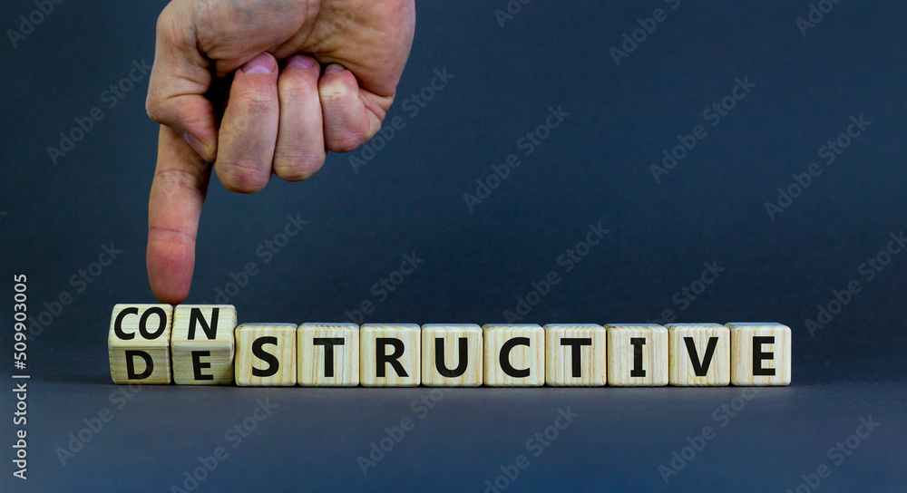 Destructive or constructive symbol. Businessman turns cubes and changes ...