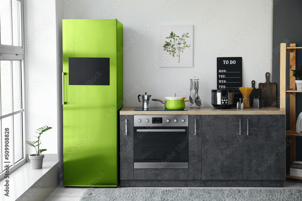 Interior of modern kitchen with green refrigerator Stock Photo | Adobe ...