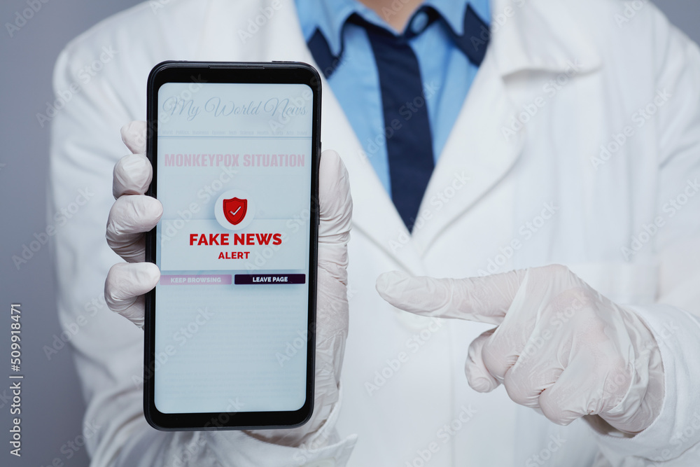 Female medical doctor showing phone with monkeypox fake news Stock-Foto ...