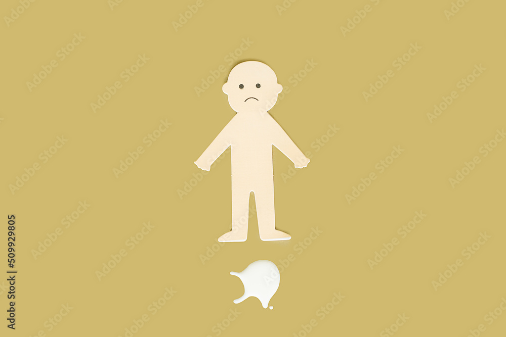 Photo of urinary incontinence concept, sad paper cut person and puddle ...