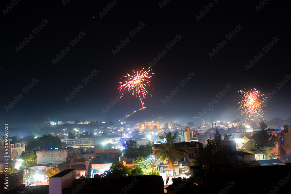 Wide angle shot of fire works in the city during the Diwali festival in ...