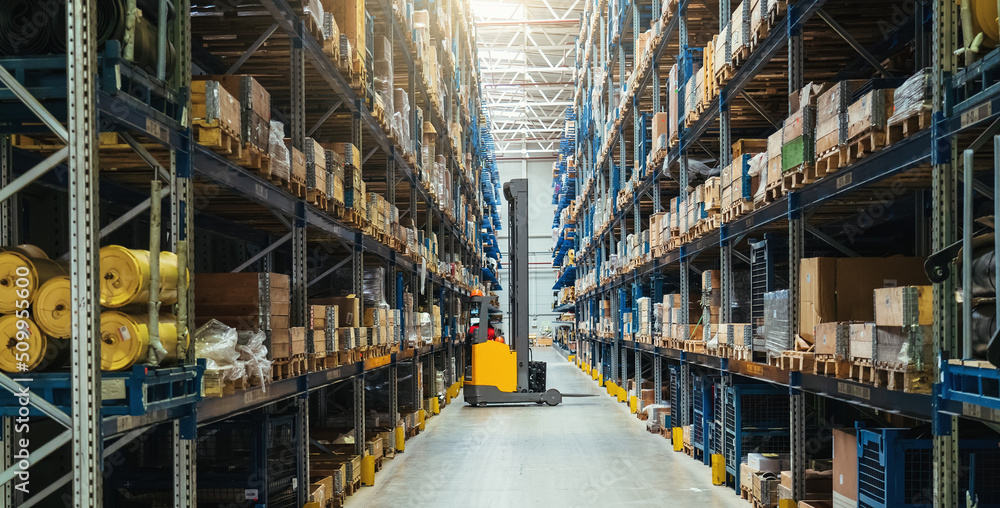 Modern distribution warehouse interior with many goods in boxes on ...