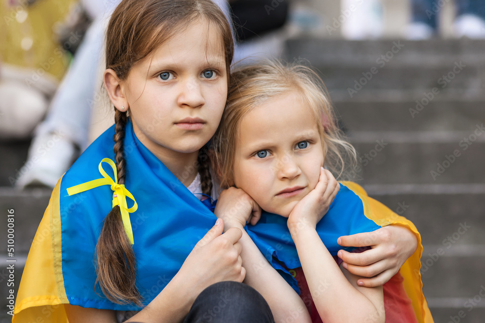 Ukrainian Children . Sad Migrant Children. Two frightened Girls wrapped ...