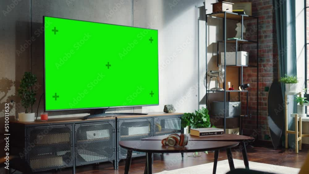 Big Green Screen Television on Modern Console in Simple Loft Living ...