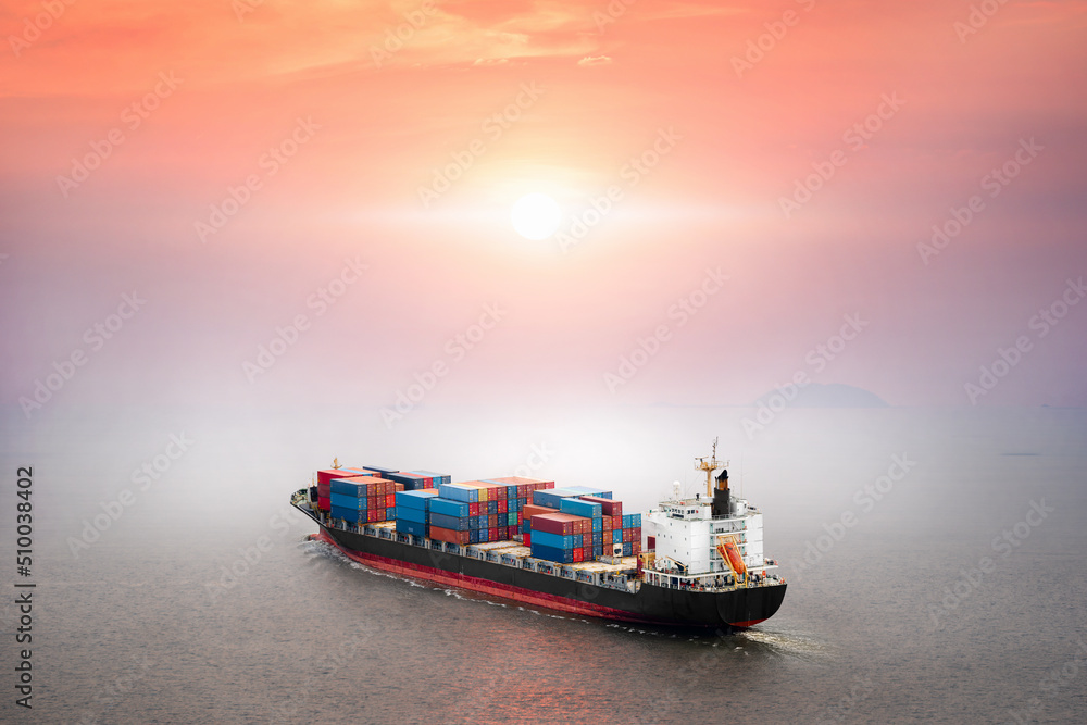 Poster Container ship in the ocean at sunset sky background with copy ...