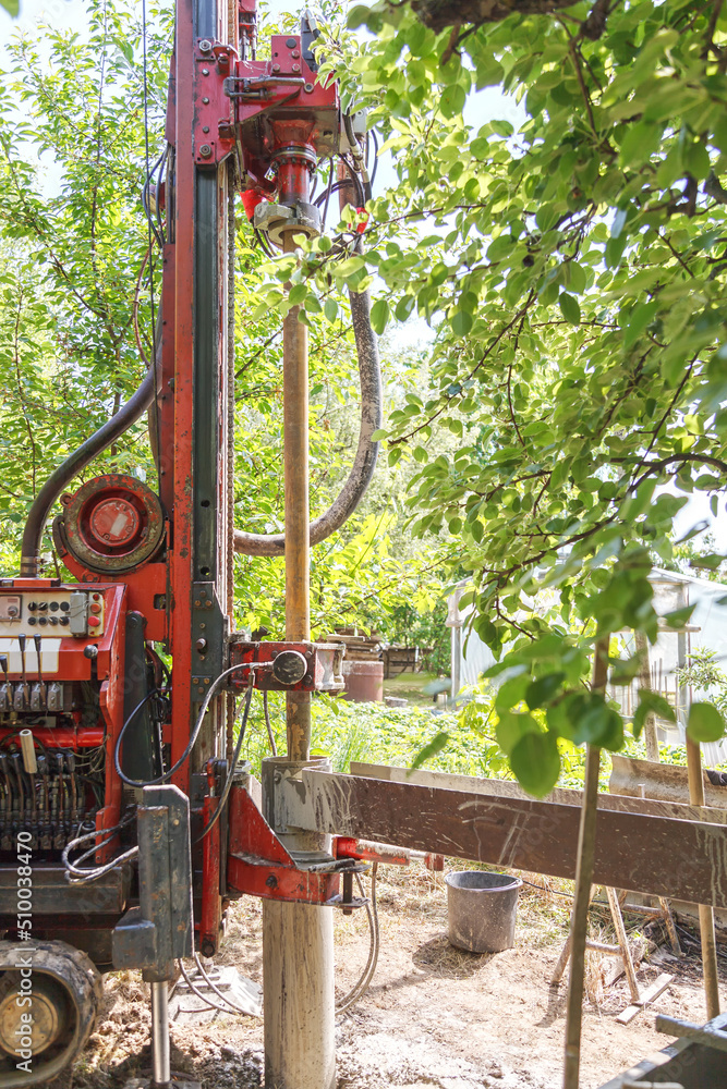 Water Well Drilling Rig. Modern rotary drilling rig drills well at home ...