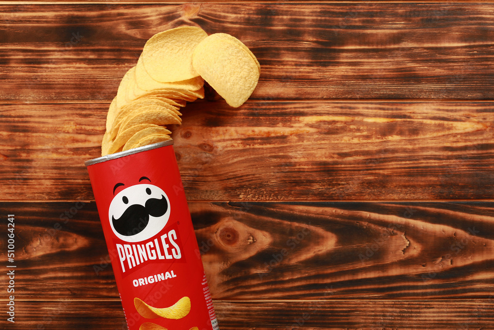 Pringles potato chips in a box on wooden background with copy space ...