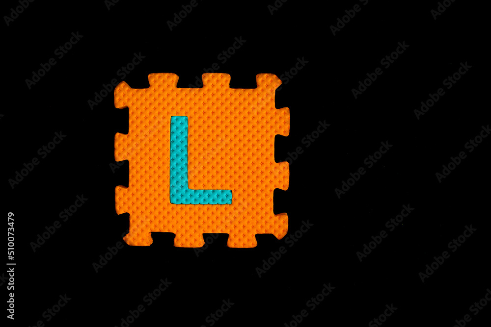 Colorful alphabet puzzle isolated on black background. alphabet ...
