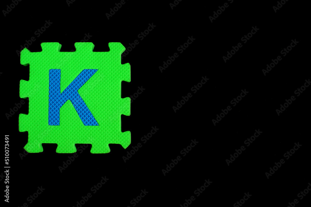 Colorful alphabet puzzle isolated on black background. alphabet ...