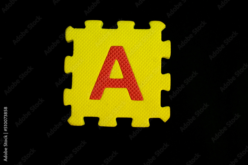 Colorful alphabet puzzle isolated on black background. alphabet ...
