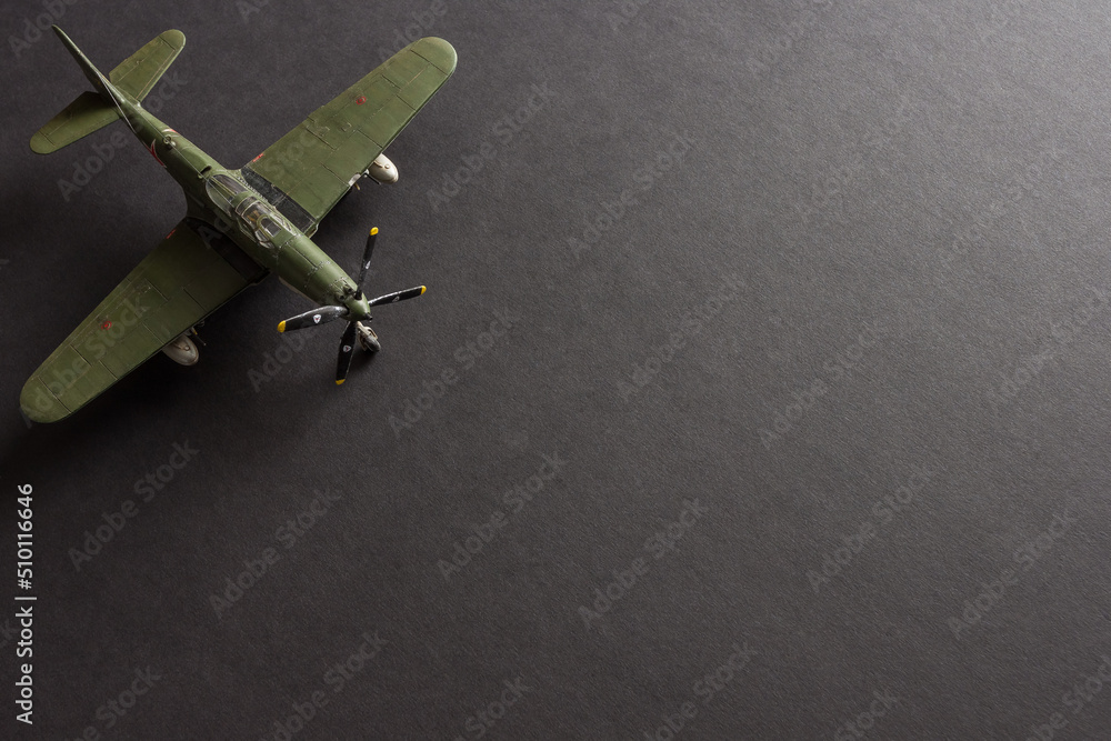 Scale model of a fighter aircraft. Plastic assembly kit. Background ...