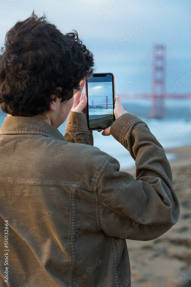 Boy snapping photo of Golden Gate Stock Photo | Adobe Stock