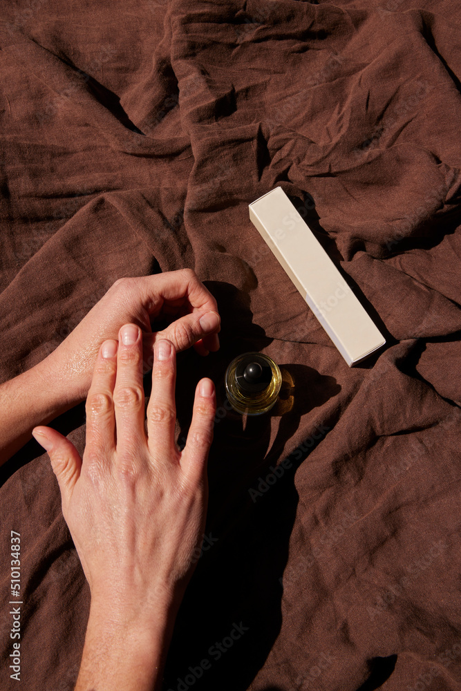 Hand applying oil Stock Photo | Adobe Stock