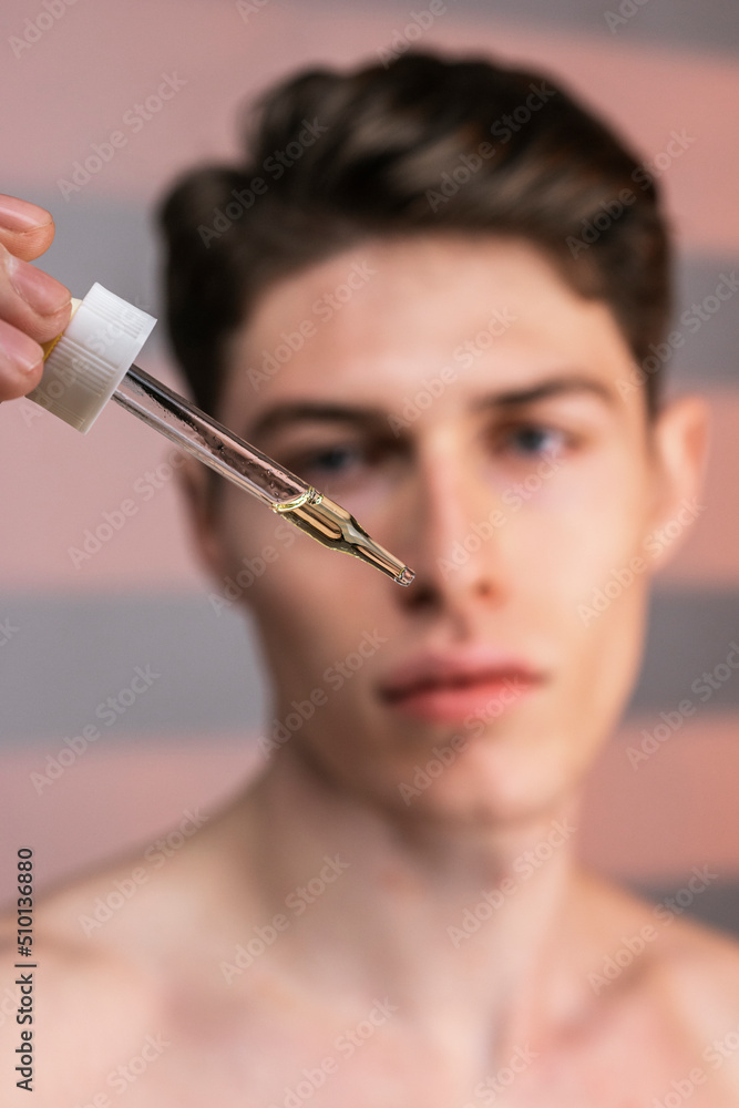 Serum dripping on male face, male skin care Stock Photo | Adobe Stock