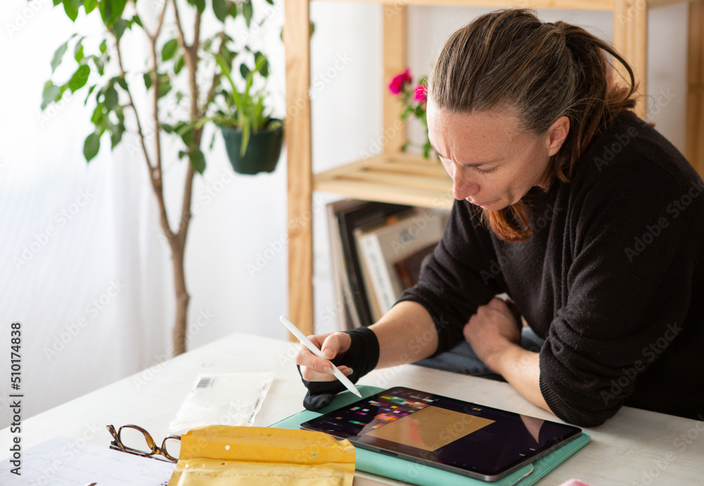 Freelance illustrator choosing from color palettes. Stock Photo | Adobe ...