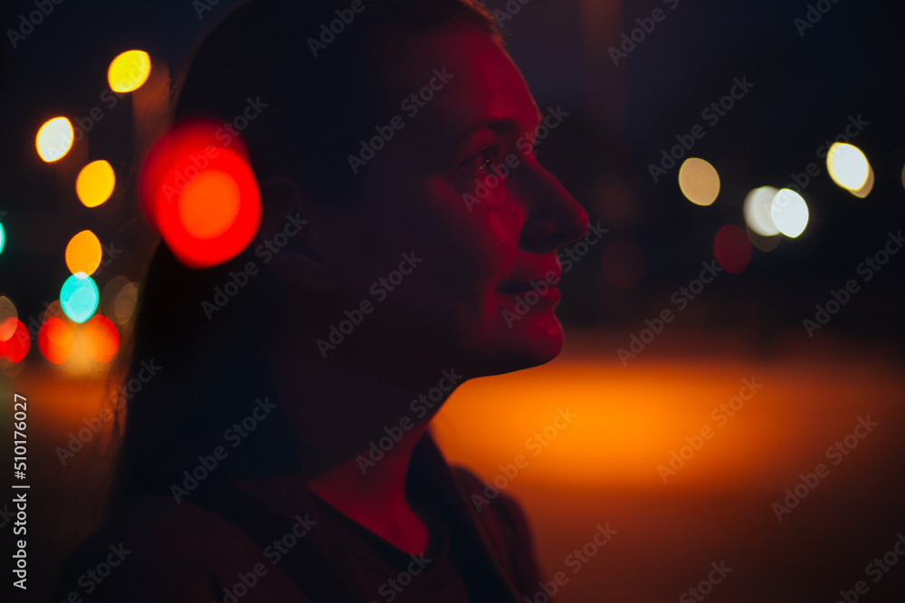 red light portrait of a woman with blurred city lights Stock Photo ...