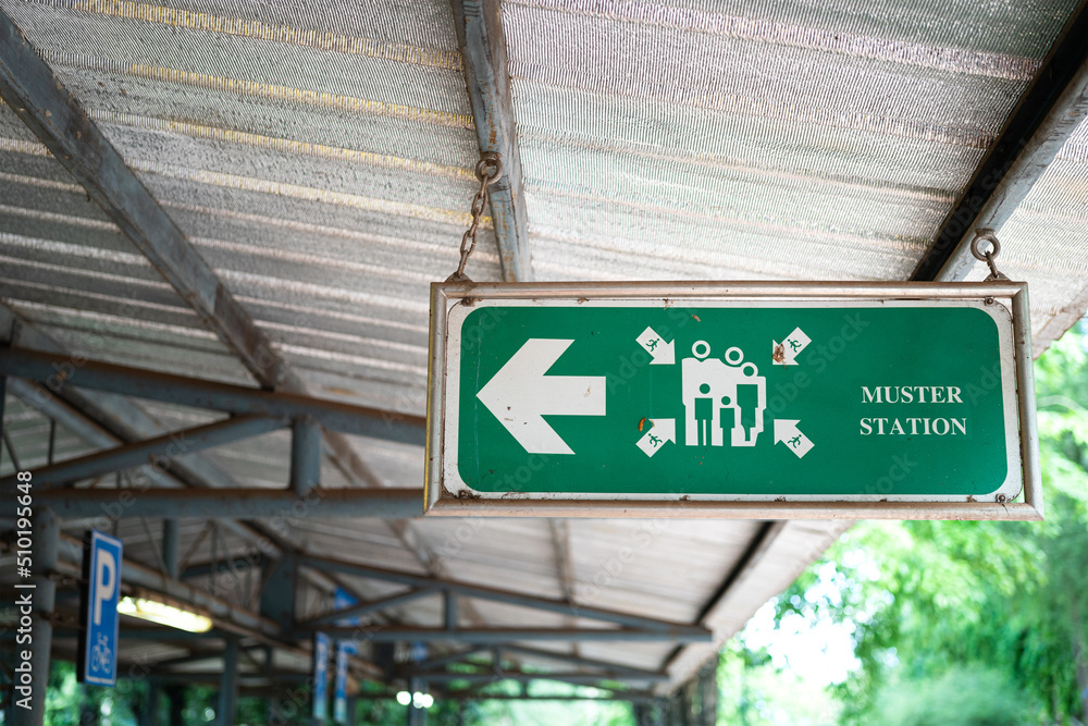 "Muster point assembly" metal sign with icon and arrow direction, using ...