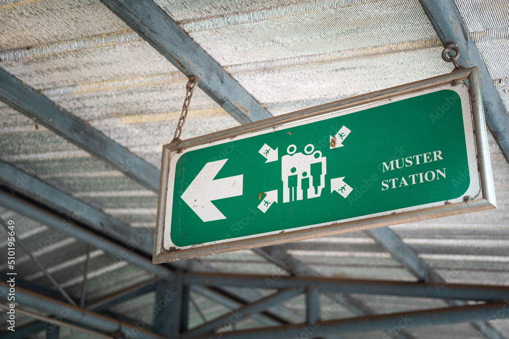 "Muster point assembly" metal sign with icon and arrow direction, using ...
