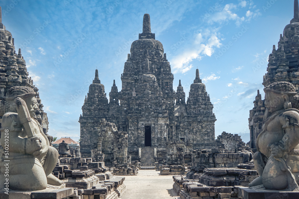 Font view of Sewu temple with statues in the summer morning. Candi Sewu, Buddhist temple of ...