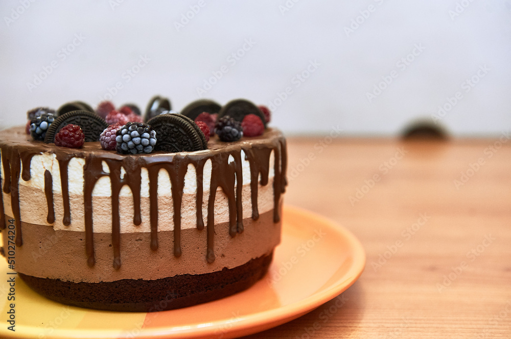 chocolate cake with three chocolates, fresh berries on the cake. cake ...