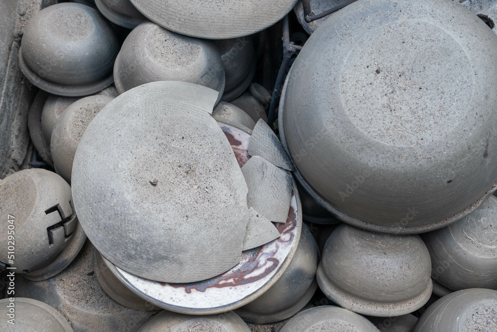 opening of a ceramic kiln, Unique handmade pots and dishes of clay ...