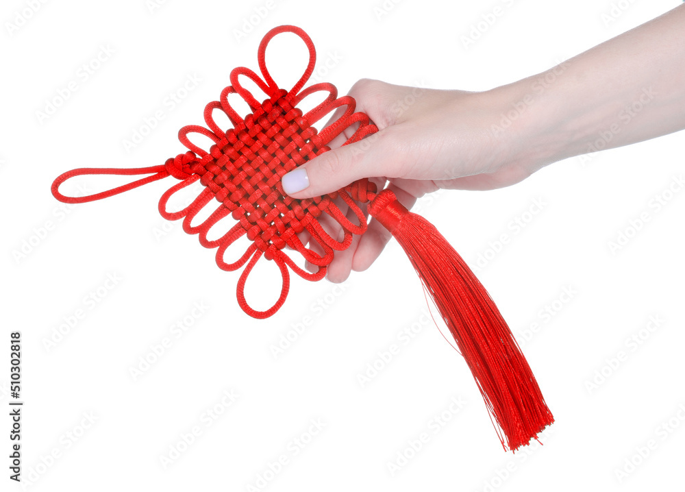 Red braided amulet in hand on white background isolation Stock Photo ...