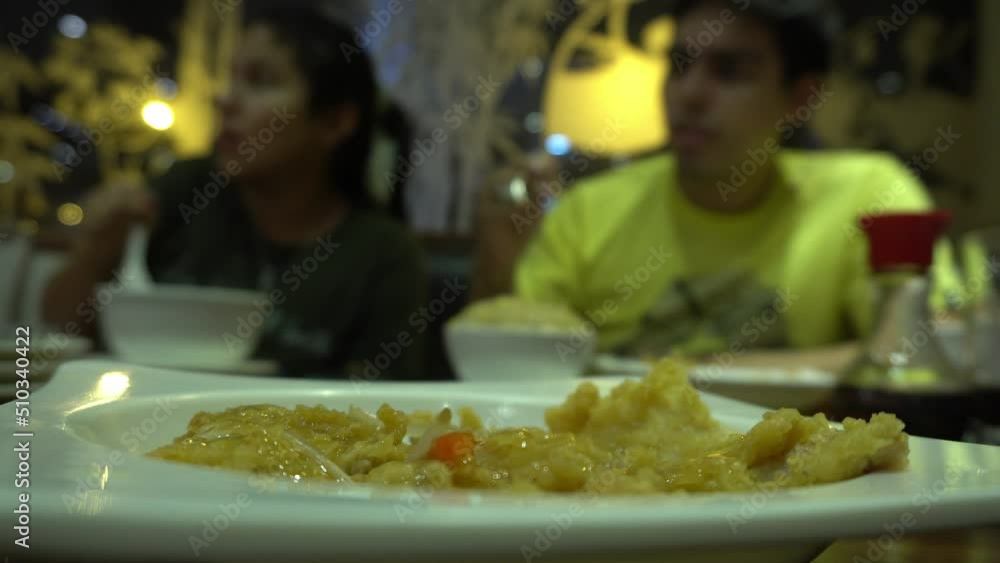 closeup of a chaufa rice dish with chijaukay chicken, typical peruvian ...