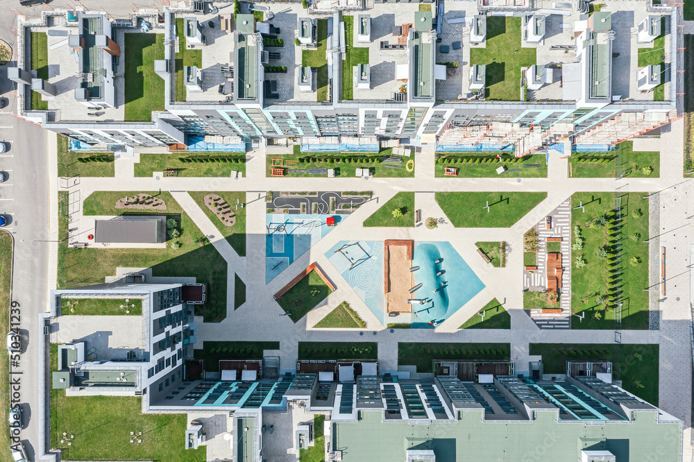 aerial top view of playground in courtyard of multistory apartment ...