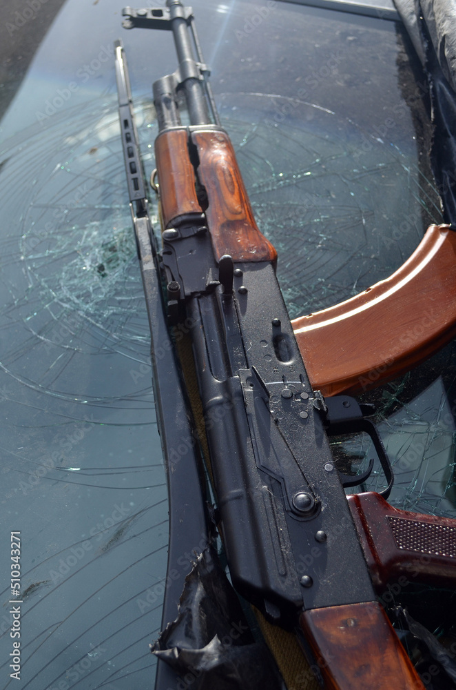 AKM(Avtomat Kalashnikova) version of Kalashnikov assault rifle and car ...