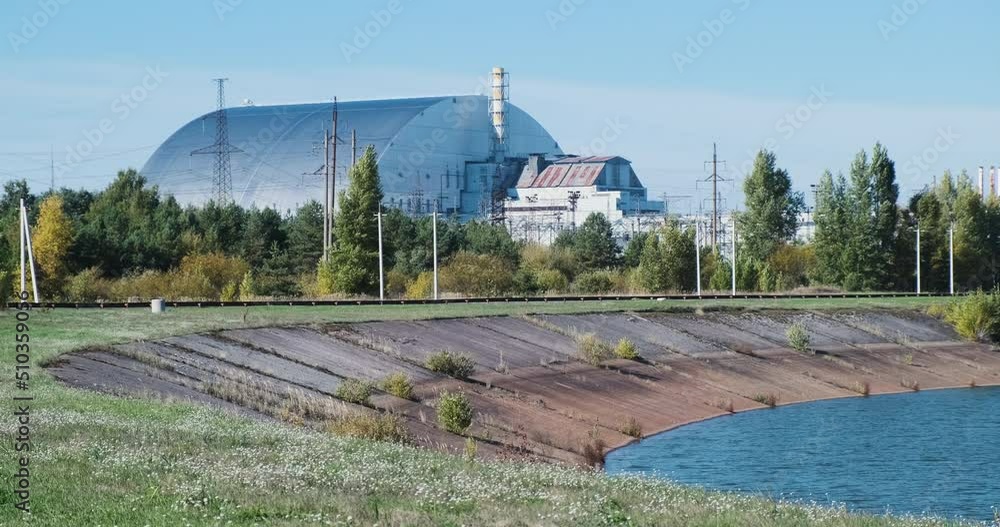 Shiny large metal sarcophagus. Disposal of radioactive waste. Reactor ...