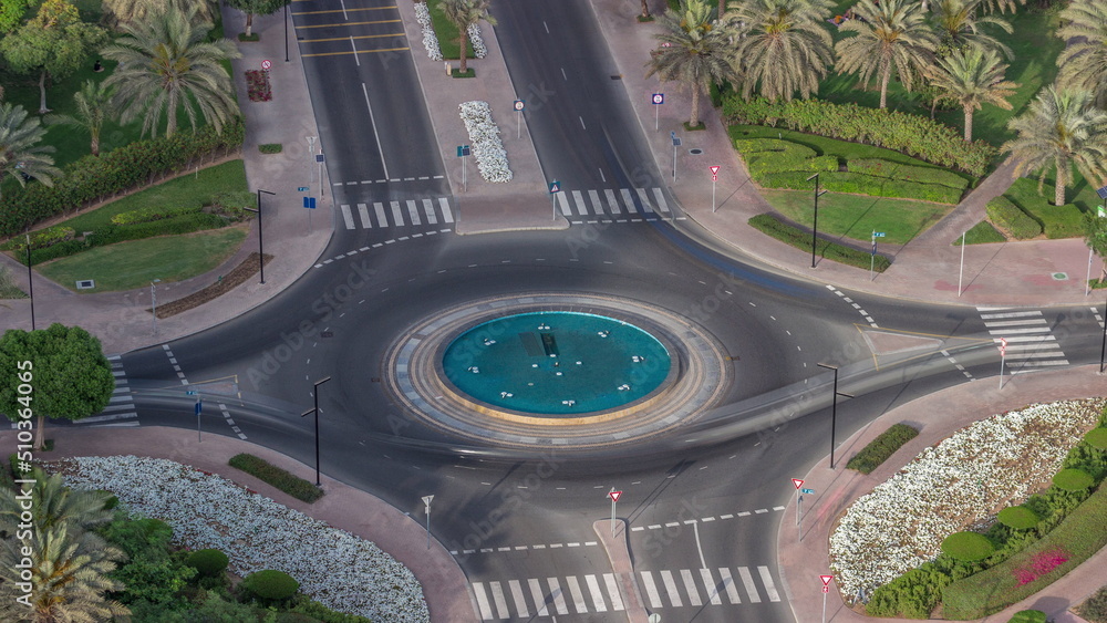 Traffic on a road intersection with roundabout in Barsha Heights and ...