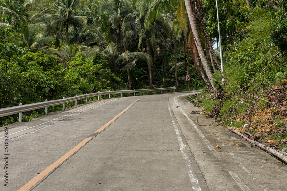 A two lane concrete highway traversing Central Bohol, Philippines ...