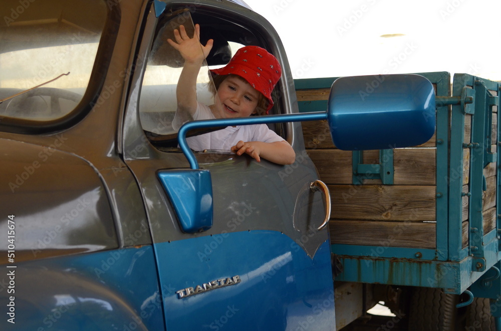 Ramla. Israel. Truck and transport museum. A little boy is driving a ...