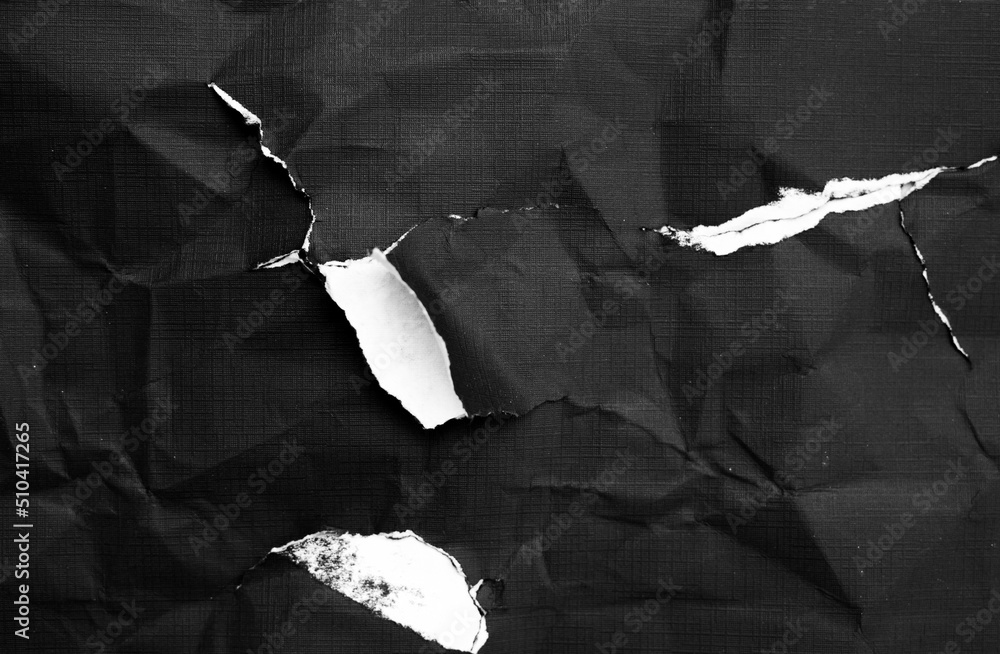 Black paper with white tears for the background. Crumpled paper texture ...