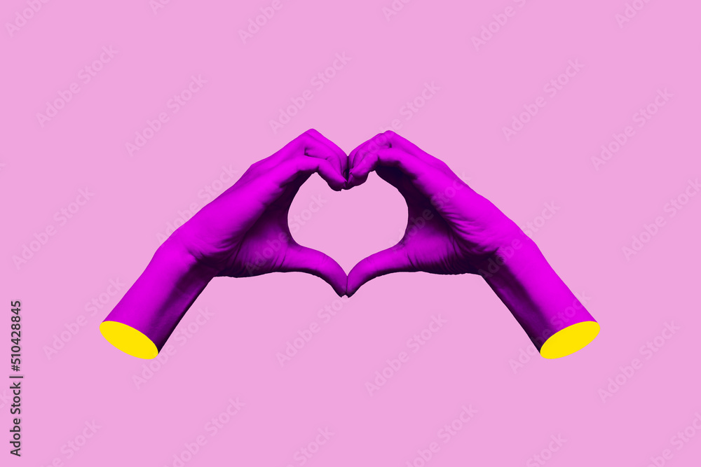 Purple human female hands showing a heart shape isolated on a pink ...