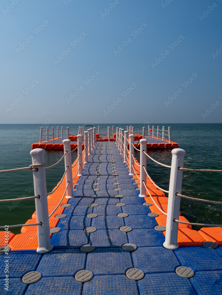 Floating piers along shore are place for tourists walk. Mooring boat ...